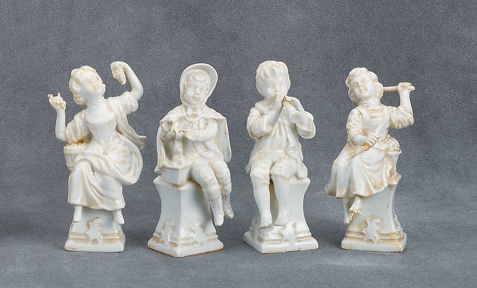 Wholesale Set of Four 7" Porcelain Figurines – Children at Play Theme ...